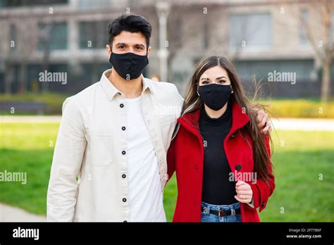 Portrait Of A Young Couple Wearing Masks Covid And Coronavirus Concept