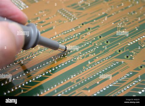 Hand With Probe Testing Electronic Circuit Board Stock Photo Alamy