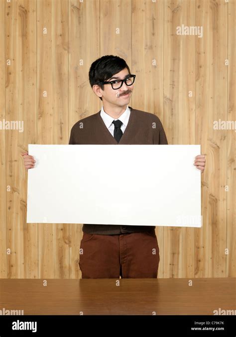 Studio Portrait Of Businessman Holding Blank Placard Stock Photo Alamy