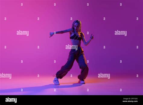 Portrait With Modern Young Dancer Wearing Fashion Clothes In Motion