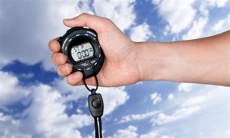 Premium Photo Hand Holding Stopwatch