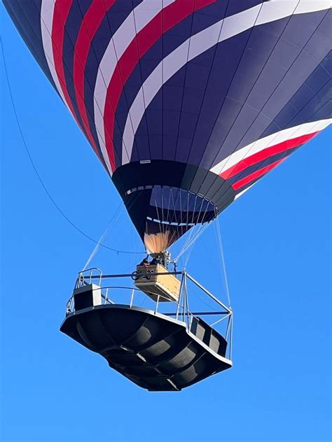 Hot Air Balloon With Suspended Skatepark Seen Floating In Wiltshire
