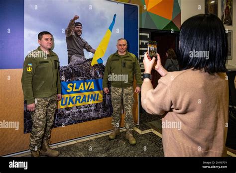 ukrainians pose with the poster of the movie ‘slava ukraine directed by french intellectual