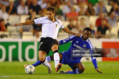 Jordi Alba Of Valencia Is Tackled By Jon Obi Mikel Of Chelsea During