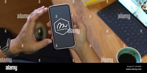 close up view of male using mock up smartphone while sitting at