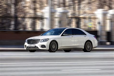 White Mercedes Benz W222 S Class Driving On The Street Showing The Car