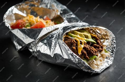 Premium Photo Burrito Wrapped In Foil Highlighting Portability