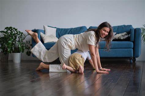 Premium Photo Happy Mindful Single Mother Doing Morning Exercises In