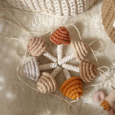 Several Knitted Objects Are Arranged On A White Surface With Twine And