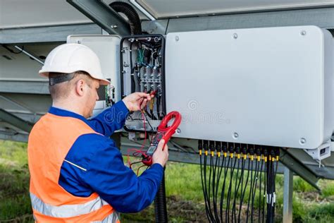 The Inspector Checks The Actual Output Voltage Level Of Inverter Stock Image Image Of