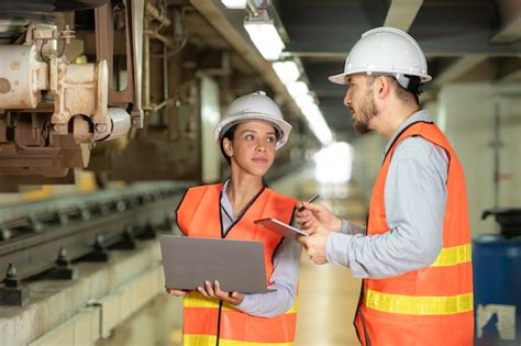 Premium Photo Male And Female Engineers Work Together In An Electric Repair Station Inspecting