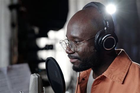 Recording Musician Wearing Headphones Speaking Into Microphone Stock Image Image Of Sound