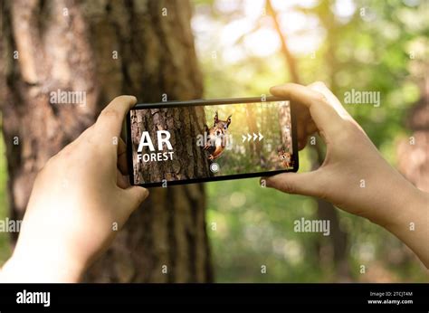 Hand Of A Woman Experiencing An Augmented Reality Ar Application Using A Smartphone In The