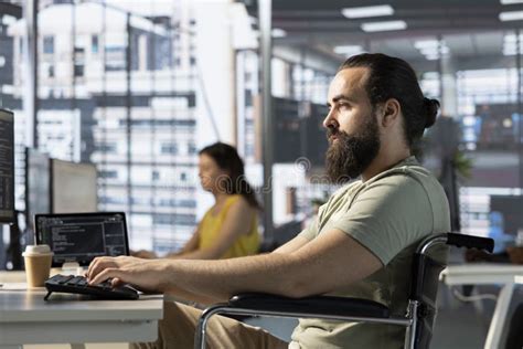 Engineer In Office Utilizing Cloud Computing Resources Stock Image