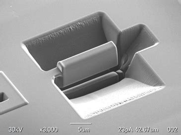 OmniProbe 350 Nano Manipulator Inside Specimen Chamber Of FIB SEM Products JEOL Ltd