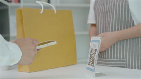 Customer Use Smartphones To Scan Qr Codes To Pay In Store With Digital
