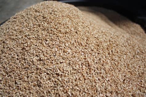 Low Energy Comminution Of Woody Biomass To Create Precision Feedstock