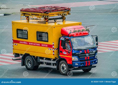 Electrical Workers On Telehandler With Bucket Installing High Tension