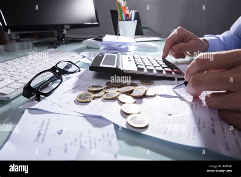 Businessperson Calculating Receipt With Calculator Stock Photo Alamy