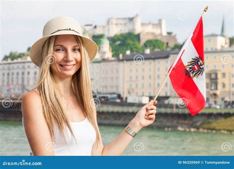 Austrian Flag With Serbian Flag On A Tree Stump Royalty Free Stock