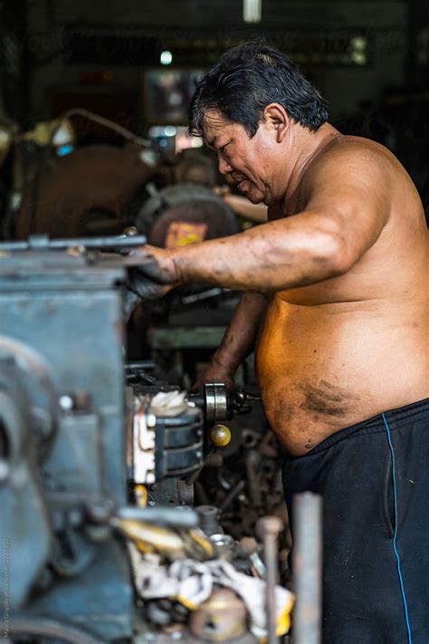 A Man At Work In A Mechanical Workshop By Stocksy Contributor Mauro Grigollo Stocksy