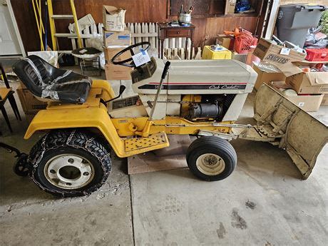 J K Estate Sales Auctions Cub Cadet 128 Riding Mower With Plow