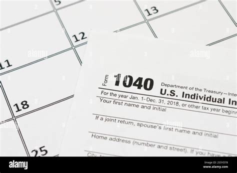 Irs Form 1040 Individual Income Tax Return Blank Lies On Empty Calendar
