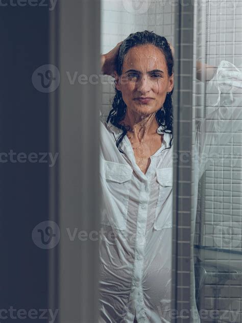 Sensual Hispanic Woman In Wet White Shirt In Shower Cabin 59002571
