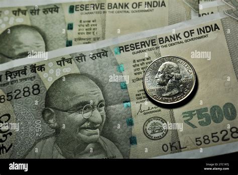 Us Quarter Dollar Is Stacked Under Indian Currency Of Five Hundred Us Quarter Dollar Is Stacked Under Indian Currency Of Five Hundred