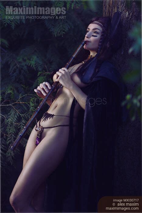 Photo Of Artistic Sensual Portrait Of A Sexy Native American Tribal Woman Playing Bamboo Flute