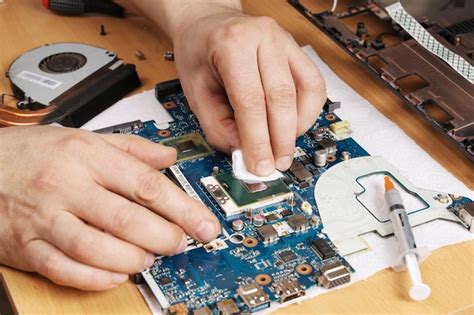 Premium Photo Hand Cleans Processor From Old Thermal Paste On