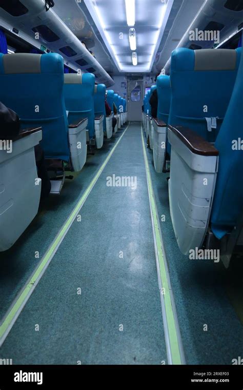 Executive Class Train Interior With Blue Seats Armrests Luggage Racks