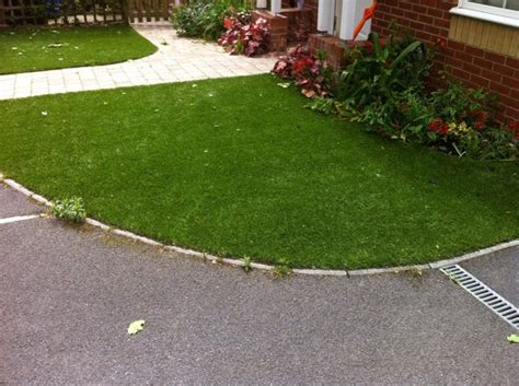 artificial grass installation replacing lawn