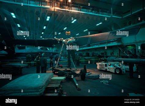 Us Marines And Us Sailors Conduct Maintenance On The Rotor Assembly