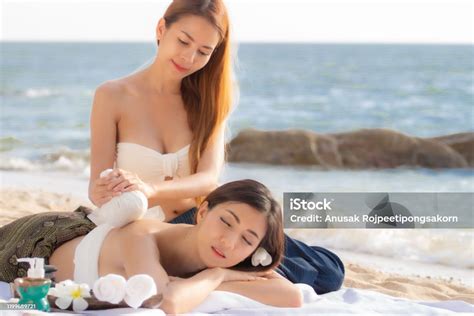 Beautiful Young And Healthy Woman In Spa Massage On Beach Near Sea
