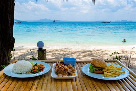 Lunch At The Beach Of Koh Kradan Island In Thailand With Thai Food And