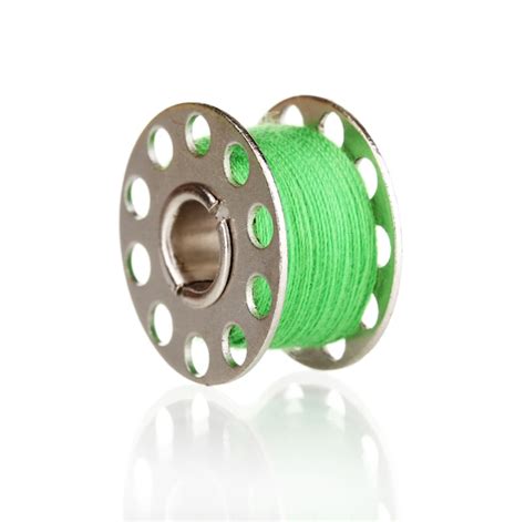 Premium Photo Metal Spool Of Thread Isolated On White
