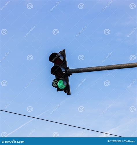 Red Signal Of Semaphore And Stop Sign In Front Of Railroad Crossing With Train Passing Royalty