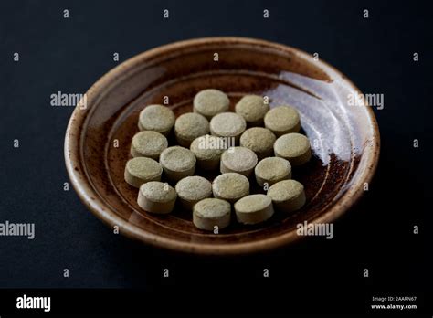 Bio Green Barley Grass Tablets Concept For A Healthy Dietary Supplementation Black Paper