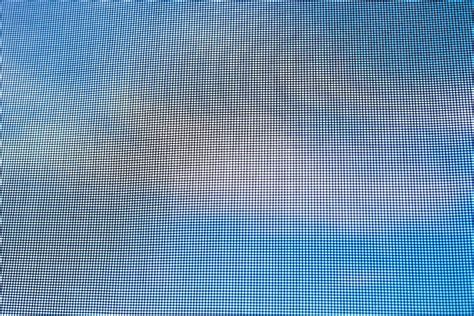 Blurry View Of Insect Repellent As Mosquito Net On Window Photo