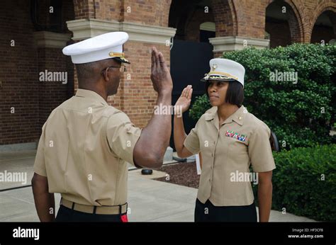 A Us Marine Recites The Uniformed Services Oath Of Office During A
