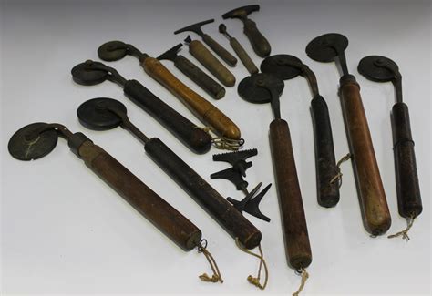 A Selection Of Mainly Brass And Wooden Handled Bookbinding Tools