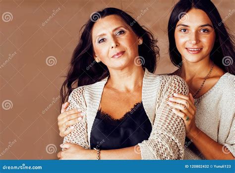 Cute Pretty Teen Daughter With Mature Mother Hugging Fashion St Stock