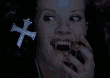 Vampire Holding Cross