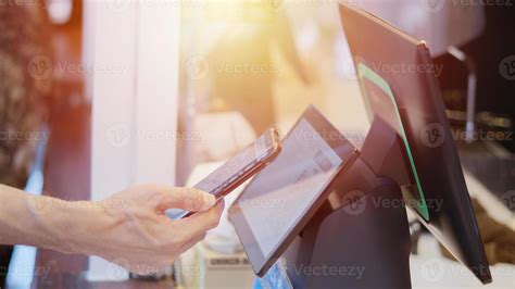 Close Up Man Uses Mobile Phone To Scan QR Code For Payment Stock Photo At Vecteezy