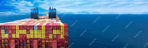 Premium Photo Stern Of Large Cargo Ship Import Export Container Box On The Ocean Sea On Blue