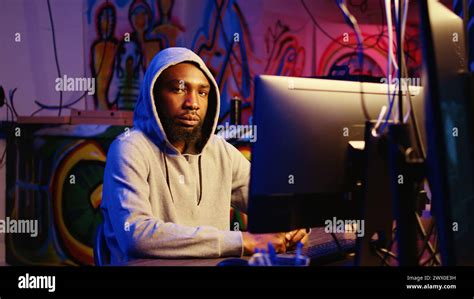 Close Up Shot Of African American Man Hacking Systems Stealing Credit Card Numbers And