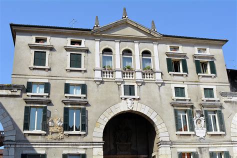 Italian Classical Building With Arches And Decorative Elements