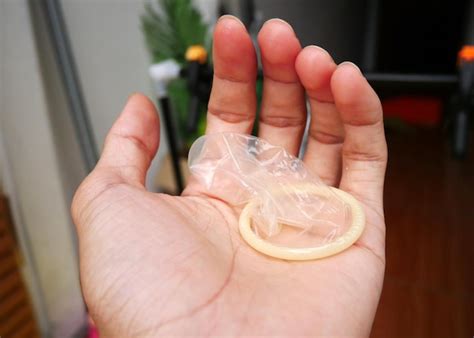 Premium Photo Used Condom In Man039s Hand Condoms Are Used To Protect