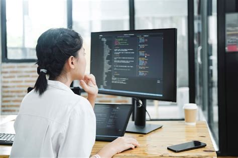 Premium Photo Programmer Coding And Developing Software Or